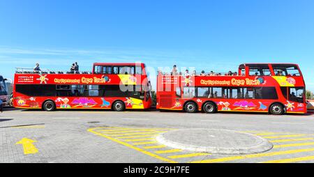 Red bus of City Sightseeing Cape Town and the skyline of Cape Town ...