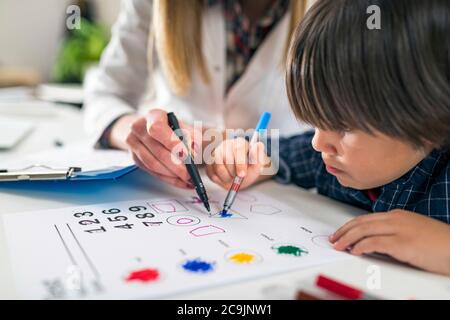 Psychology test for children. Toddler colouring shapes Stock Photo - Alamy