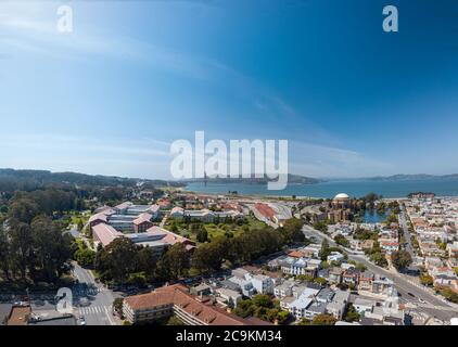 A drone shot of a cityscape under cloudy sky at sunset Stock Photo - Alamy