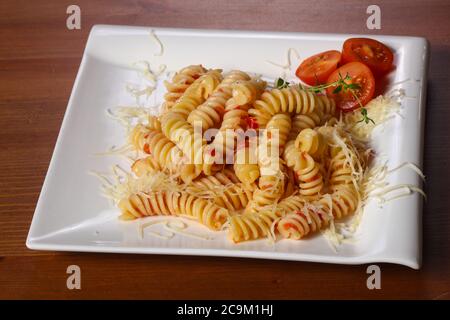Italian springs pasta with tomato sauce and cheese Stock Photo - Alamy