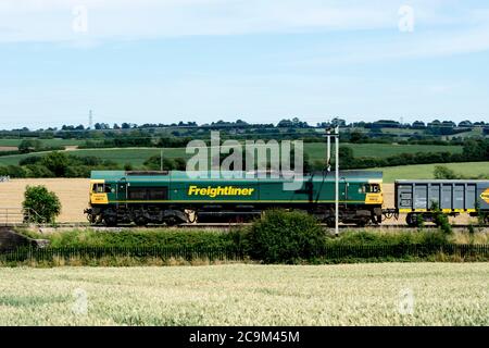 Freightliner class 66 diesel locomotive pulling intermodal freight ...