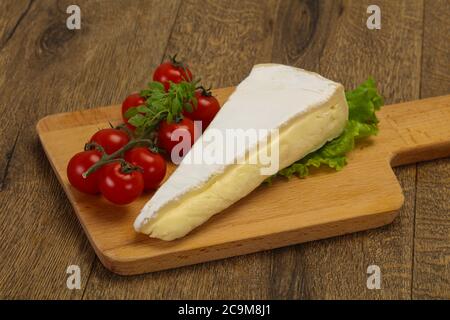 Brie cheese triangle served salad leaves Stock Photo - Alamy