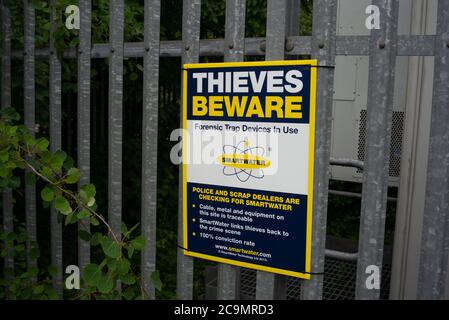 Thieves Beware Smart Water sign Stock Photo - Alamy