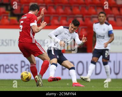 Rangers' Ianis Hagi (right) and Aberdeen's Kevin Nisbet (left) battle ...