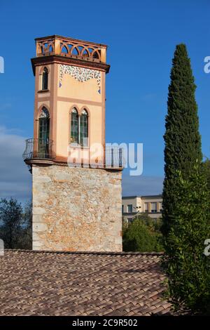 A cute little balcony on a city house decorated with bright flowers ...