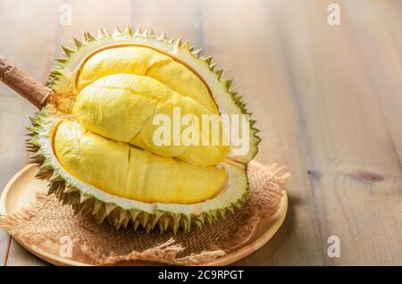 Puangmanee durian on wood plate and wood background, It's a small ...
