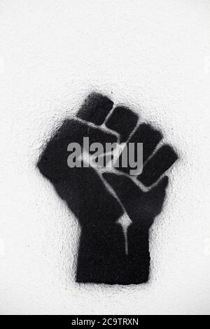 Fist clenched and raised up, strong gesture of power and protest symbol ...