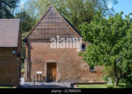 The Stables, 17th century timber framed building, with wooden planters ...