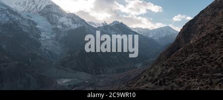 Mountain glacier over Manang village, trekking Annapurna circuit ...