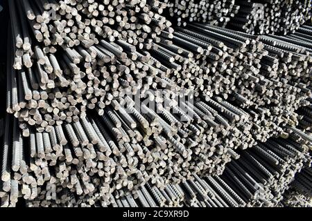 Row of steel rods in the manufacturing industry Stock Photo - Alamy