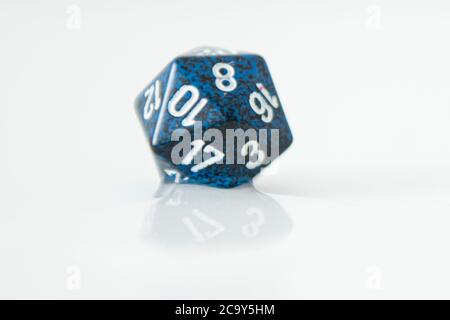 A nat 20 is rolled on a 20 sided dice used for agmes of Dungeons ...