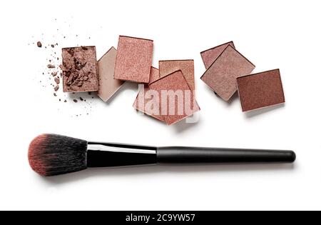 Brown face powders and makeup brush on white background Stock Photo - Alamy