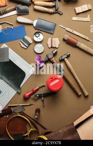 Tanner tools for leather goods on workshop. Working process of leather ...
