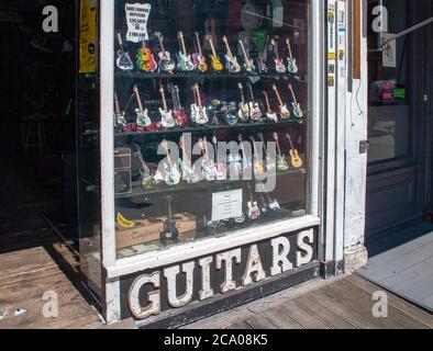 Miniature guitars in a guitar shop window display, Camden, London, U.K ...
