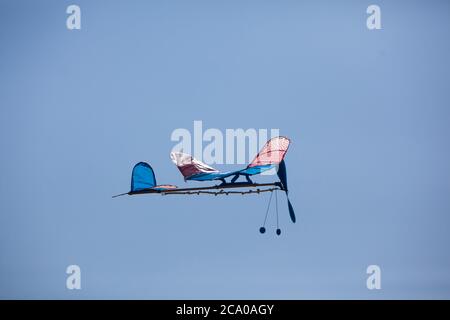 Rubber powered glider flying in the sky. model airplane Stock Photo - Alamy