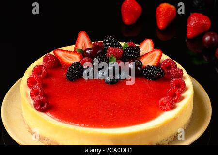 RED FRUIT CHEESECAKE PHOTOGRAVED ON BLACK BACKGROUND Stock Photo - Alamy