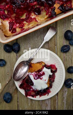 A bowl of damson crumble pie Stock Photo - Alamy