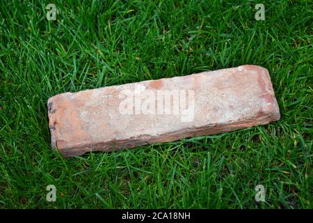 Cut red bricks range prepared to use design in the wall Stock Photo - Alamy