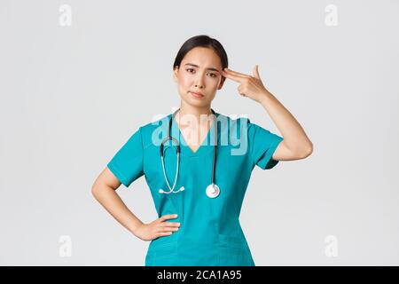Medical doctor with a gun Stock Photo - Alamy