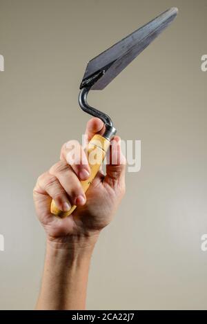 industry worker hand holding mechanical tool Stock Photo - Alamy