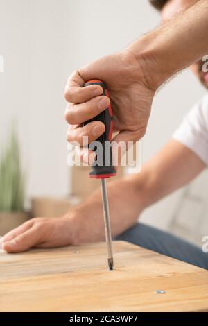 Repairman carpenter working with wooden board plank and measurin Stock ...