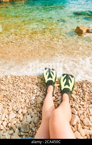 woman legs in flippers at beach sea on background copy space Stock ...