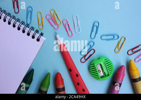 school stationery on blue paper background Stock Photo - Alamy
