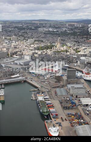 Aberdeen aerial view harbour ships with oil & gas tanks and north sea ...