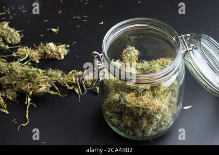 medical cannabis marijuana in a glass jar Stock Photo - Alamy
