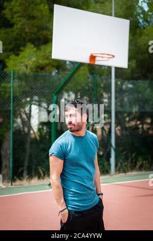 Muscle man playing basketball alone Stock Photo - Alamy