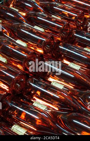 Composition with bottles of wine, rose flower and chocolate candies on ...