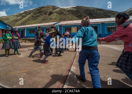 Quechua children playing outside in a small rural school in the ...