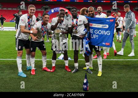 Fulham players celebrate with the Championship trophy after being ...