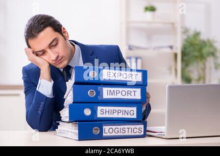 Young logistics specialist working in the office Stock Photo - Alamy
