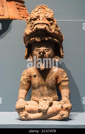 A ceramic funerary urn representing Cocijo, the Zapotec god of rain and ...