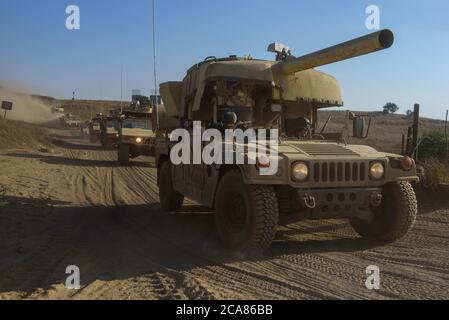 Israeli soldiers drive military vehicles during an exercise in the ...