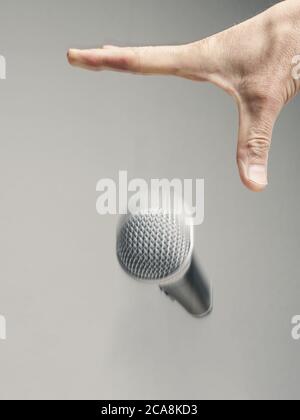 Speaker drops his microphone at the end of the speech. Mic drop concept ...
