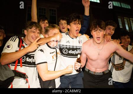 Fulham F.C. fans celebrate their team beating local rivals Brentford F ...