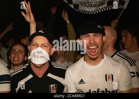 Fulham F.C. fans celebrate their team beating local rivals Brentford F ...