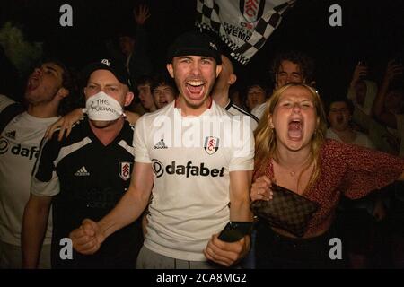 Fulham F.C. fans celebrate their team beating local rivals Brentford F ...