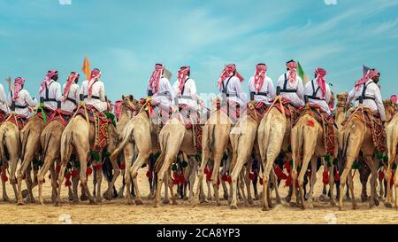 Saudi Arab Camel riders with their camels on traditional desert safari ...