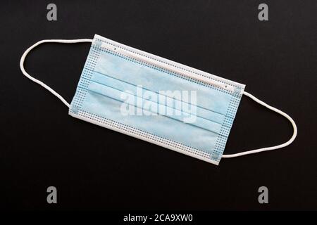 Disposable face masks on black background medicine concept Stock Photo ...