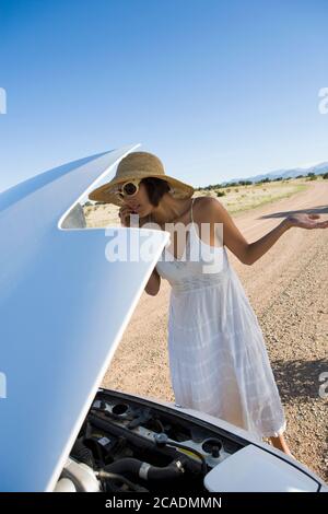 Fashion woman having troubles with the car Stock Photo - Alamy