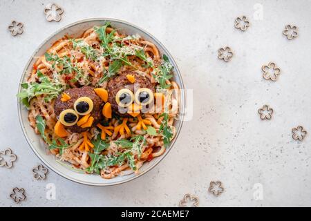 Pasta spaghetti with funny meatballs for kids. Birds in nests Stock ...
