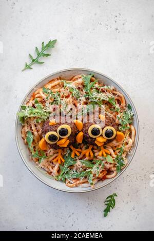 Pasta spaghetti with funny birds meatballs for kids Stock Photo - Alamy