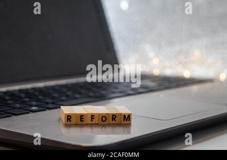 TAX REFORM letter blocks business finance concept on laptop keyboard ...