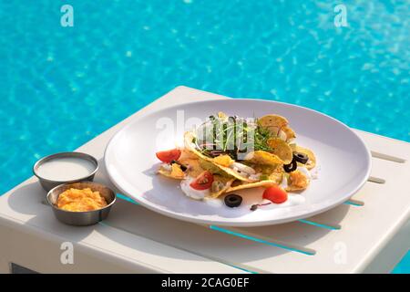 nacho and beer in swimming pool Stock Photo - Alamy