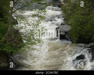 Water rushing over rocks in a river , Rivers, Rocks, Tichnor Brothers ...