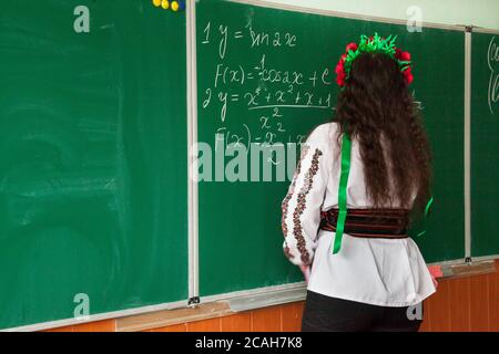 Math physics formulas on chalkboard with wooden frame Stock Photo - Alamy