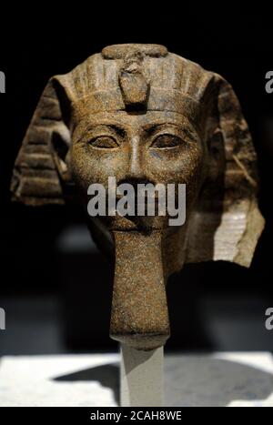 Female head, ancient Egyptian statue. Egyptian stone sculpture shows ...